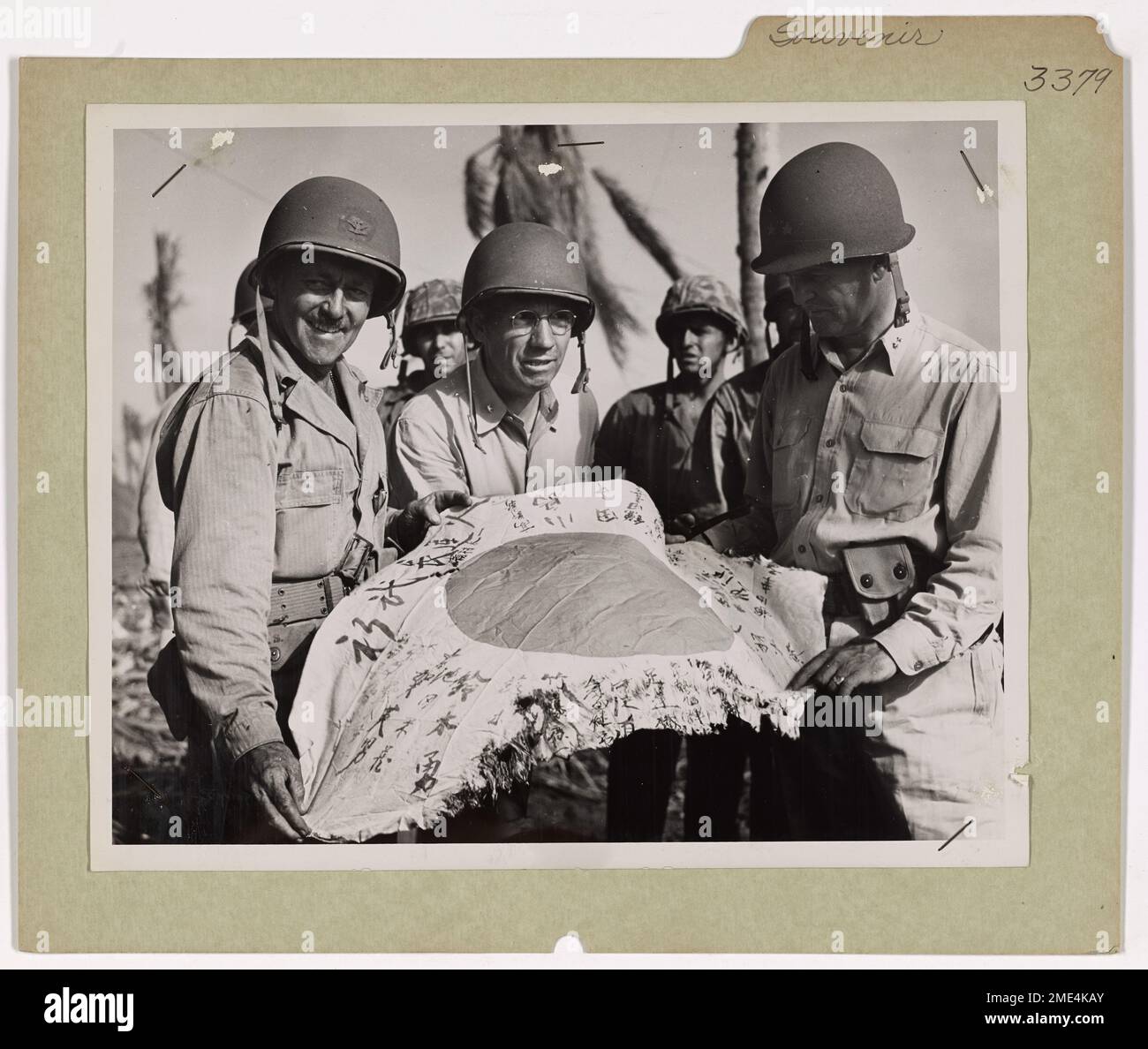 Leaders from the Army, Marine, Coast Guard, and Navy forces examine a ...