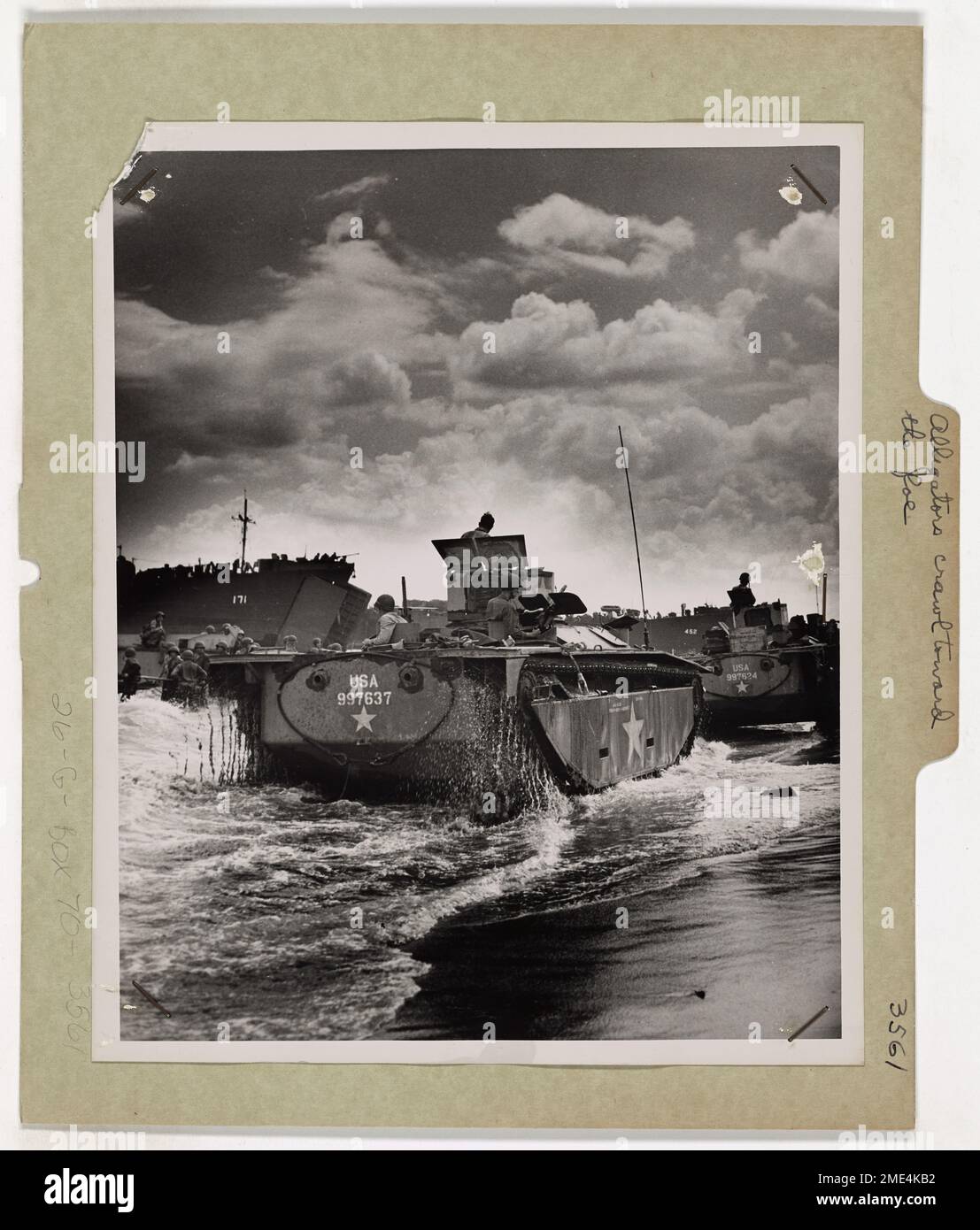 U.S. Army Alligators, armored amphibious vehicles, advance toward enemy ...