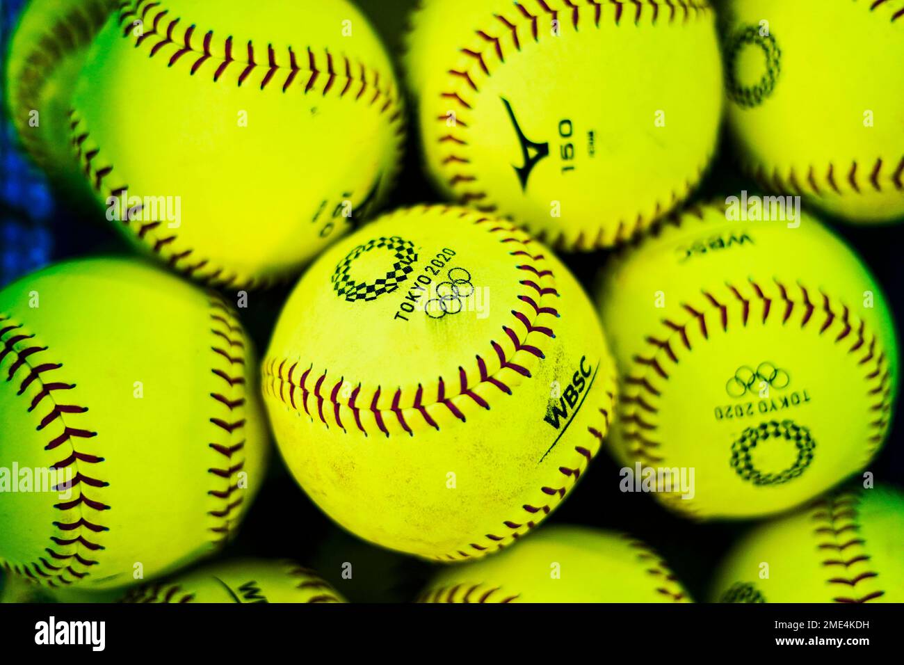 Shown are balls ahead of a softball game between Italy and Mexico at ...