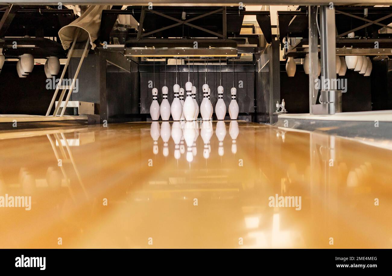Bowling pins arranged on track at alley Stock Photo - Alamy