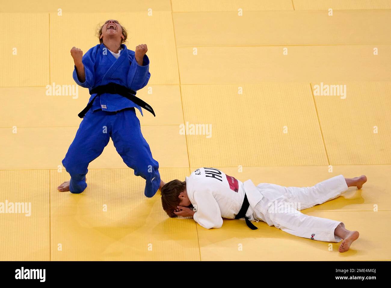 Odette Giuffrida, of Italy, left, reacts after defeating Reka Pupp, of ...