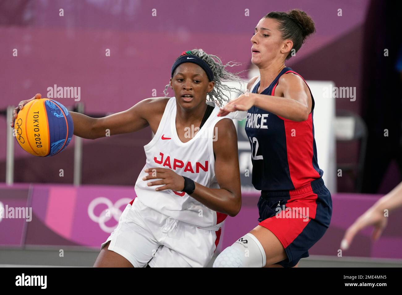 Japan's Stephanie Mawuli, left, heads to the basket past France's ...