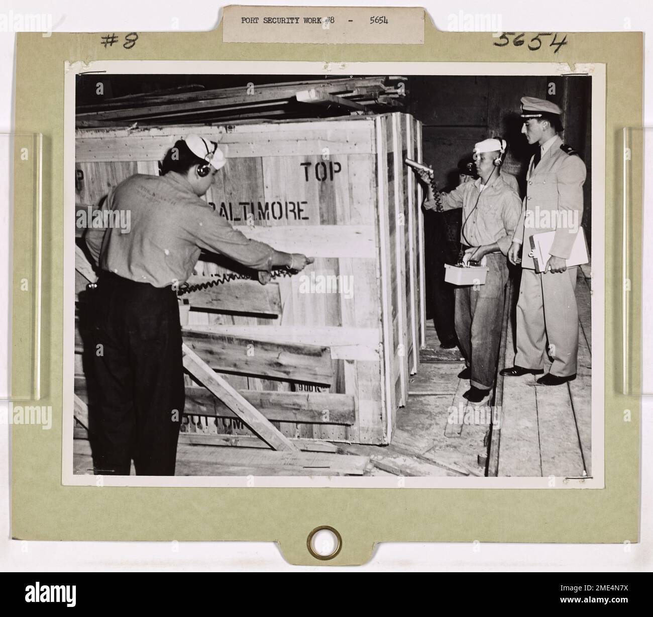 Coast Guardsmen are shown conducting security checks on a foreign ...