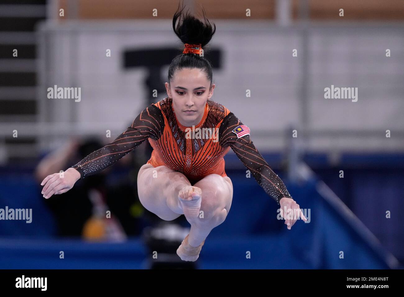 Farah Ann Abdul Hadi, of Malaysia, performs on the balance beam during ...