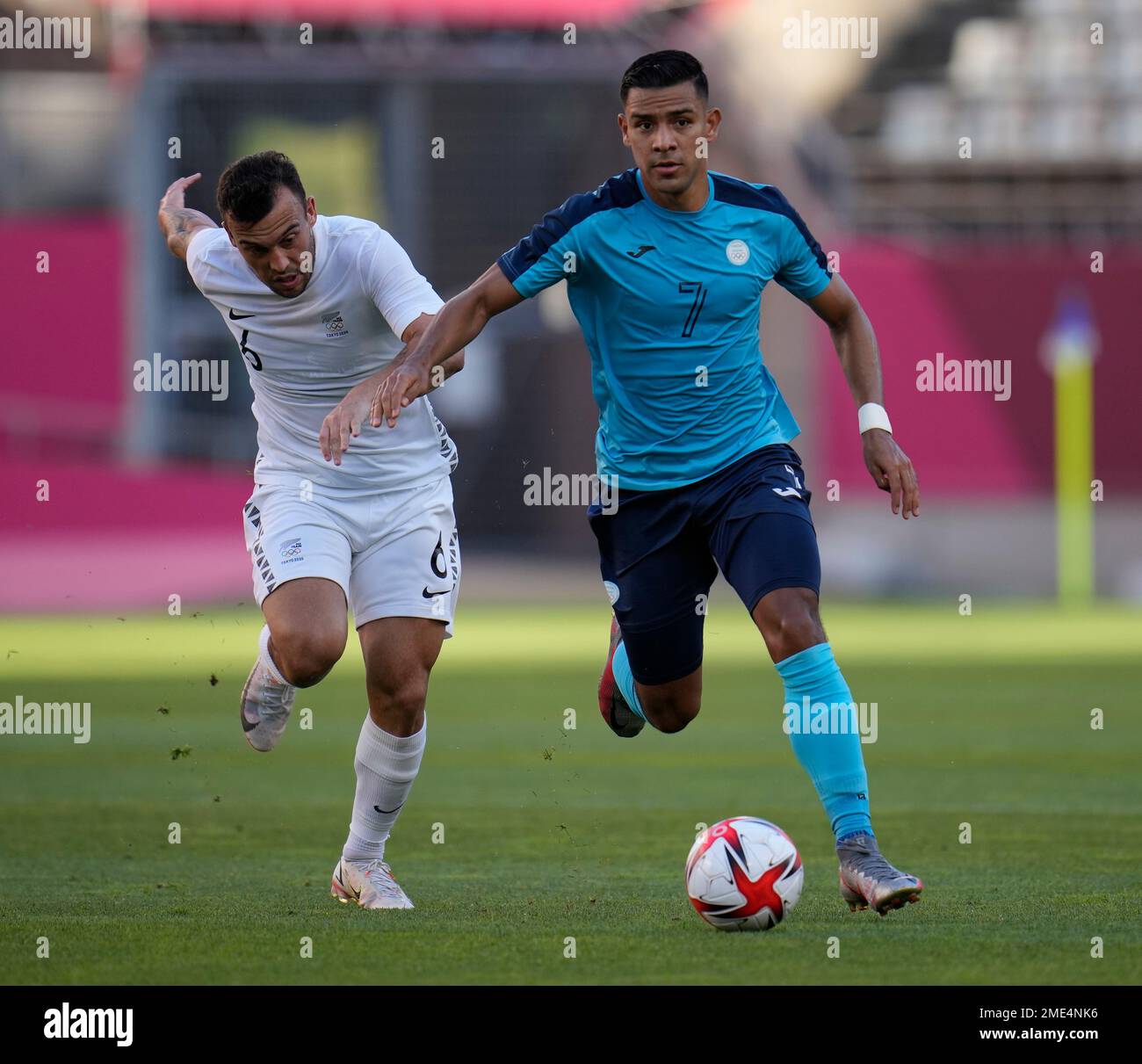 New Zealand's Clayton Lewis, left, pressures Honduras' Jose Reyes ...