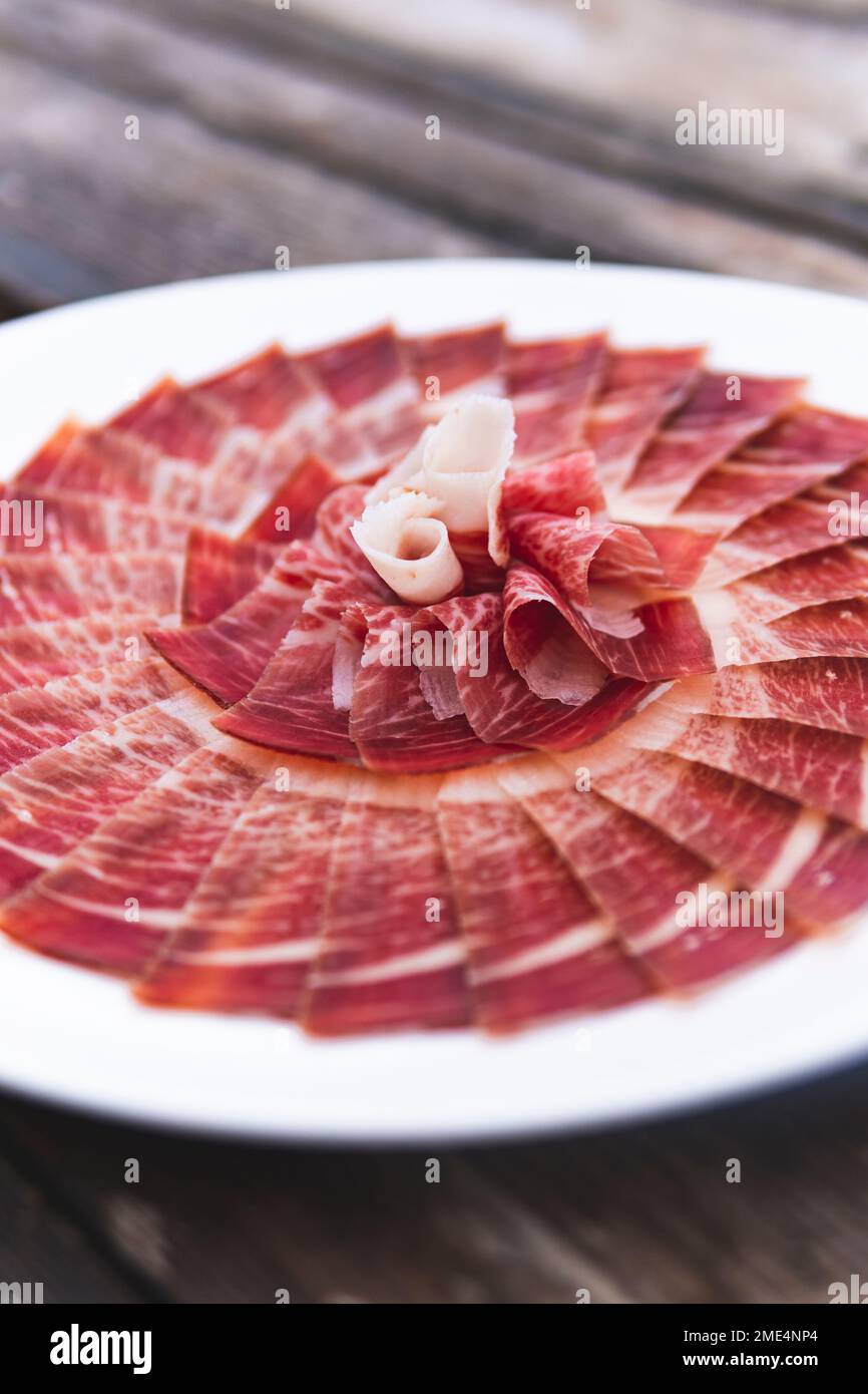 Elegantly presented plate of Iberian ham Stock Photo - Alamy