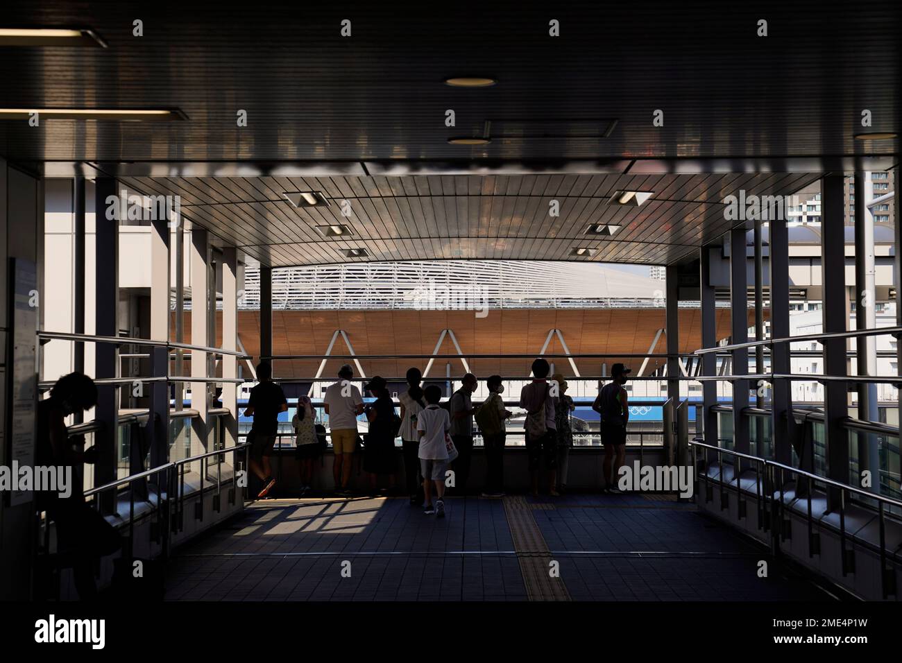 People view the Ariake Gymnastics Centre from a Yurikamome line station ...