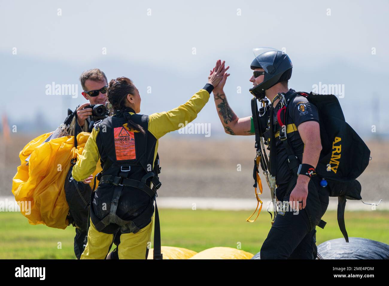 Sgt. Jonathan Pemberton of the U.S. Army Parachute Team high fives his ...