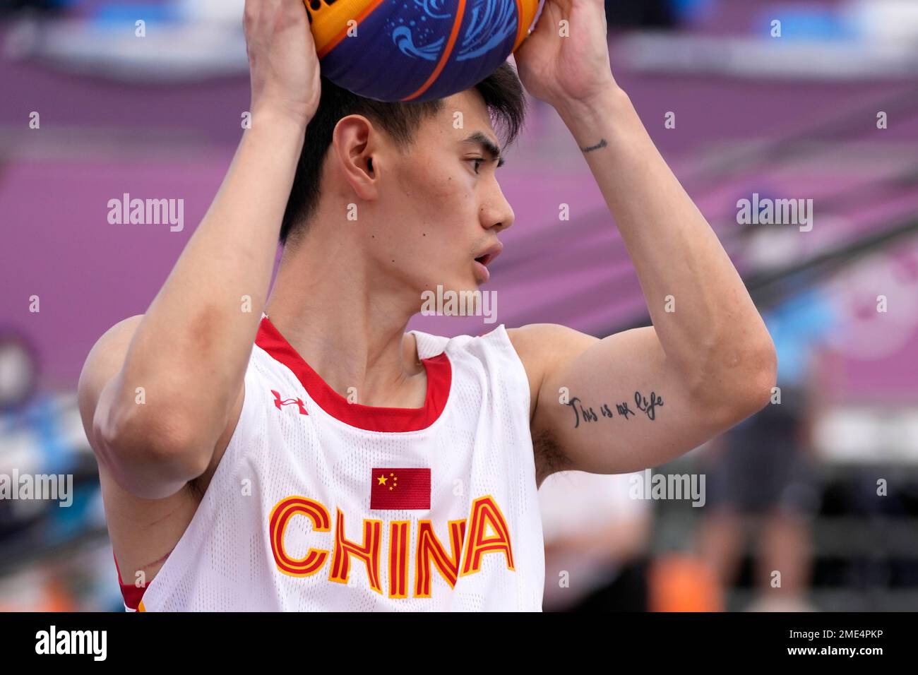 China's Yan Peng has a tattoo on his arm during a men's 3-on-3 basketball game against Latvia at ...