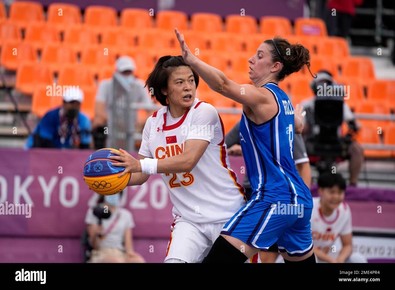 China's Wang Lili (23) looks to pass around Italy's Giulia Rulli (8 ...