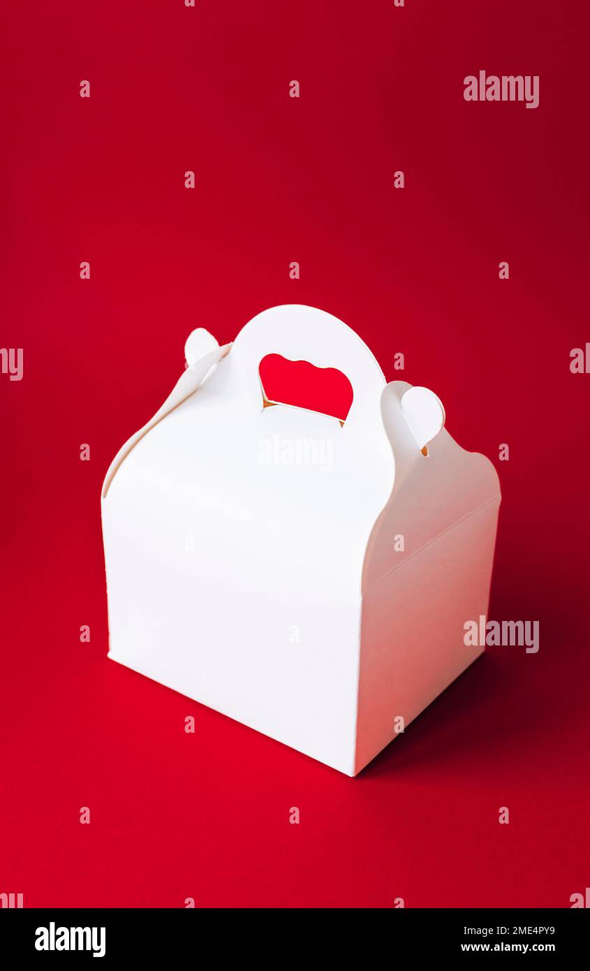Take away box against red background Stock Photo - Alamy