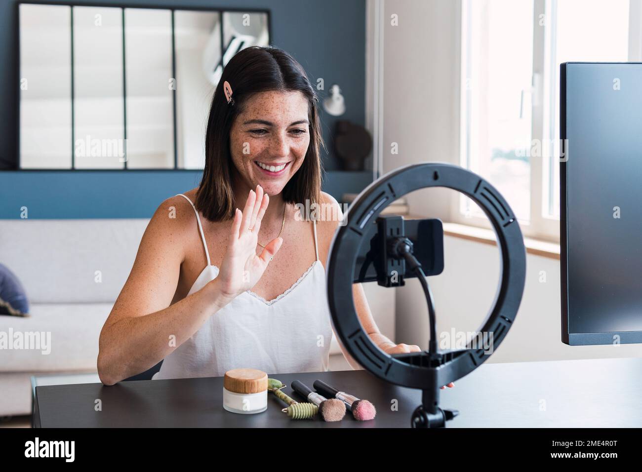 Smiling female influencer talking hi-res stock photography and images ...