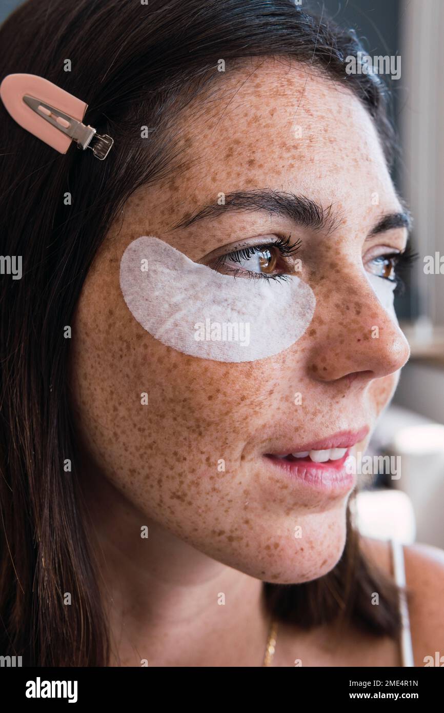 Woman under eye patches hi-res stock photography and images - Alamy
