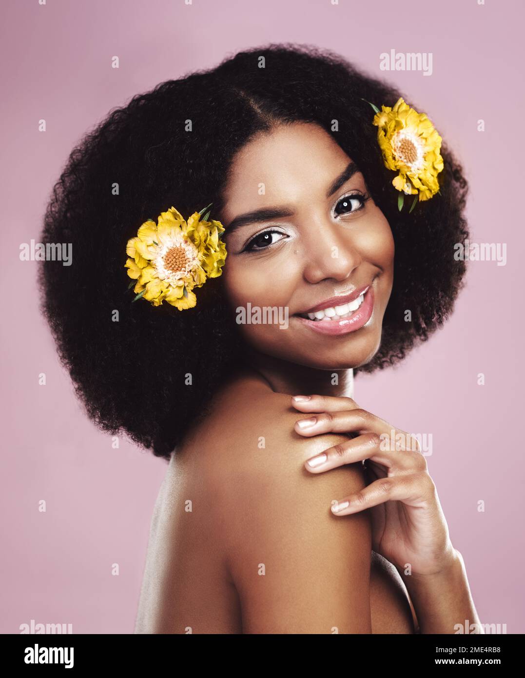 Shes the most beautiful flower. Studio shot of a beautiful young woman ...