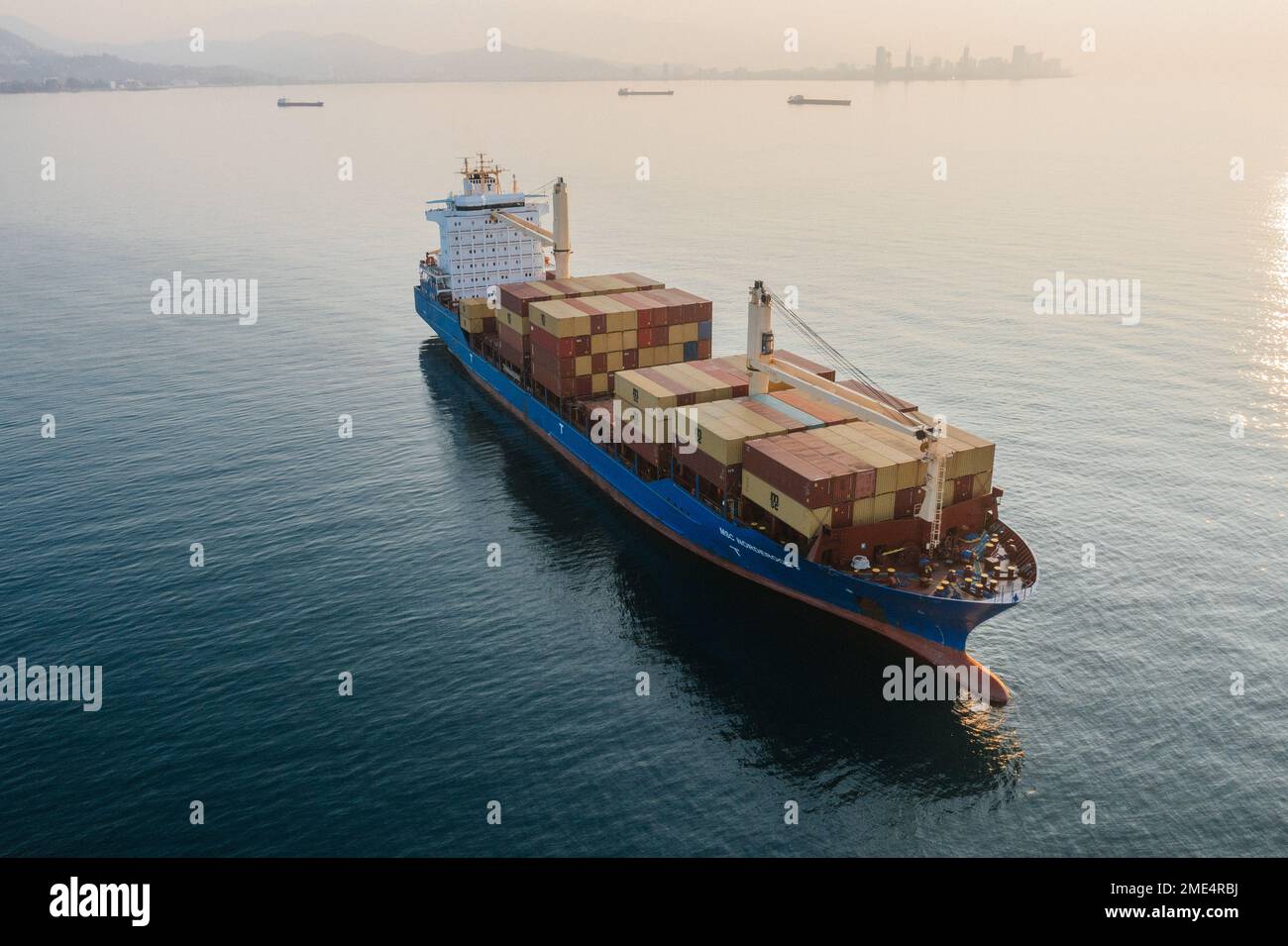 Cargo ship with containers in the open sea, aerial drone view Stock ...
