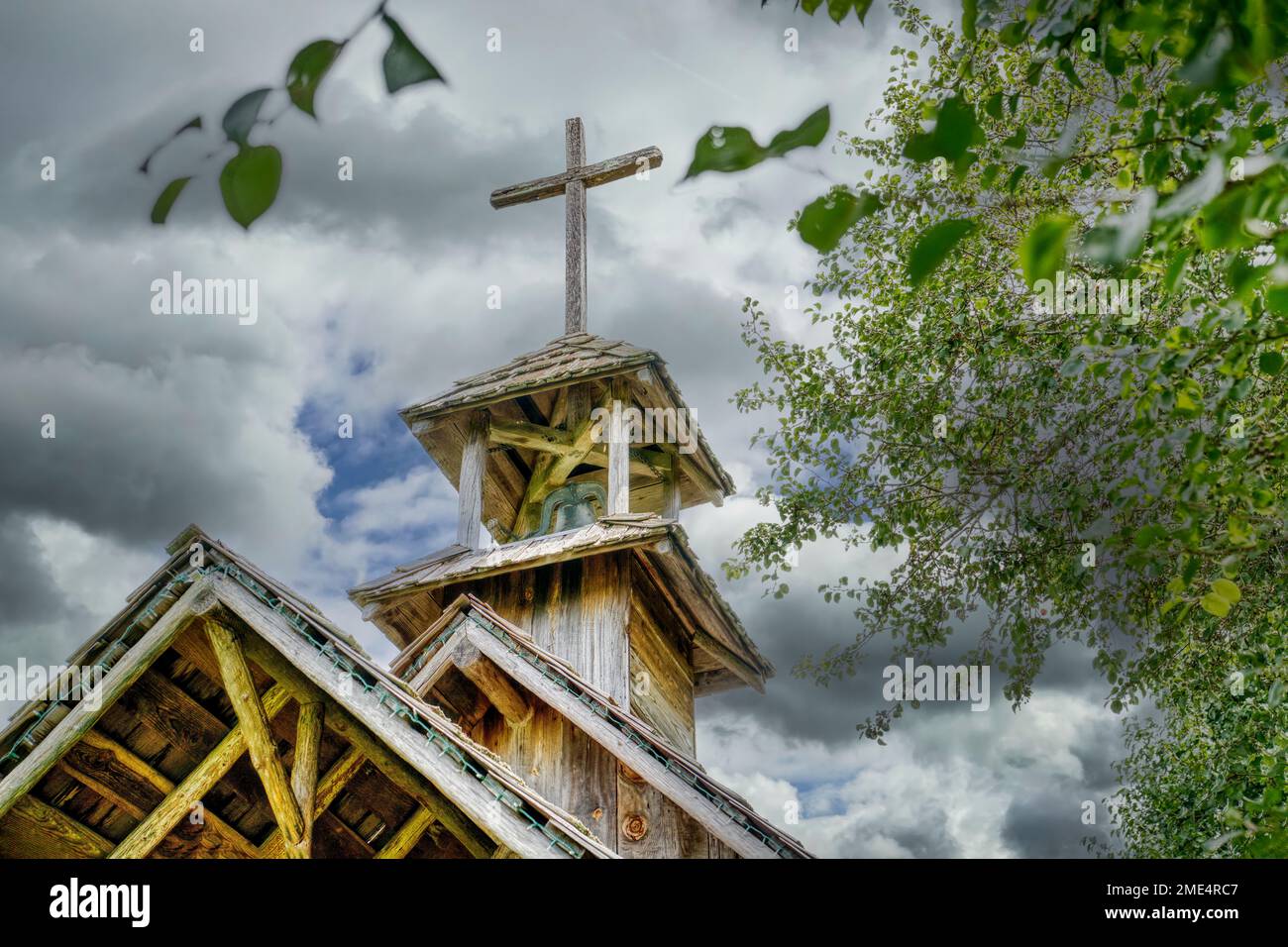 Looking up at the cross and bell tower of the Chapel of Peace Church at ...