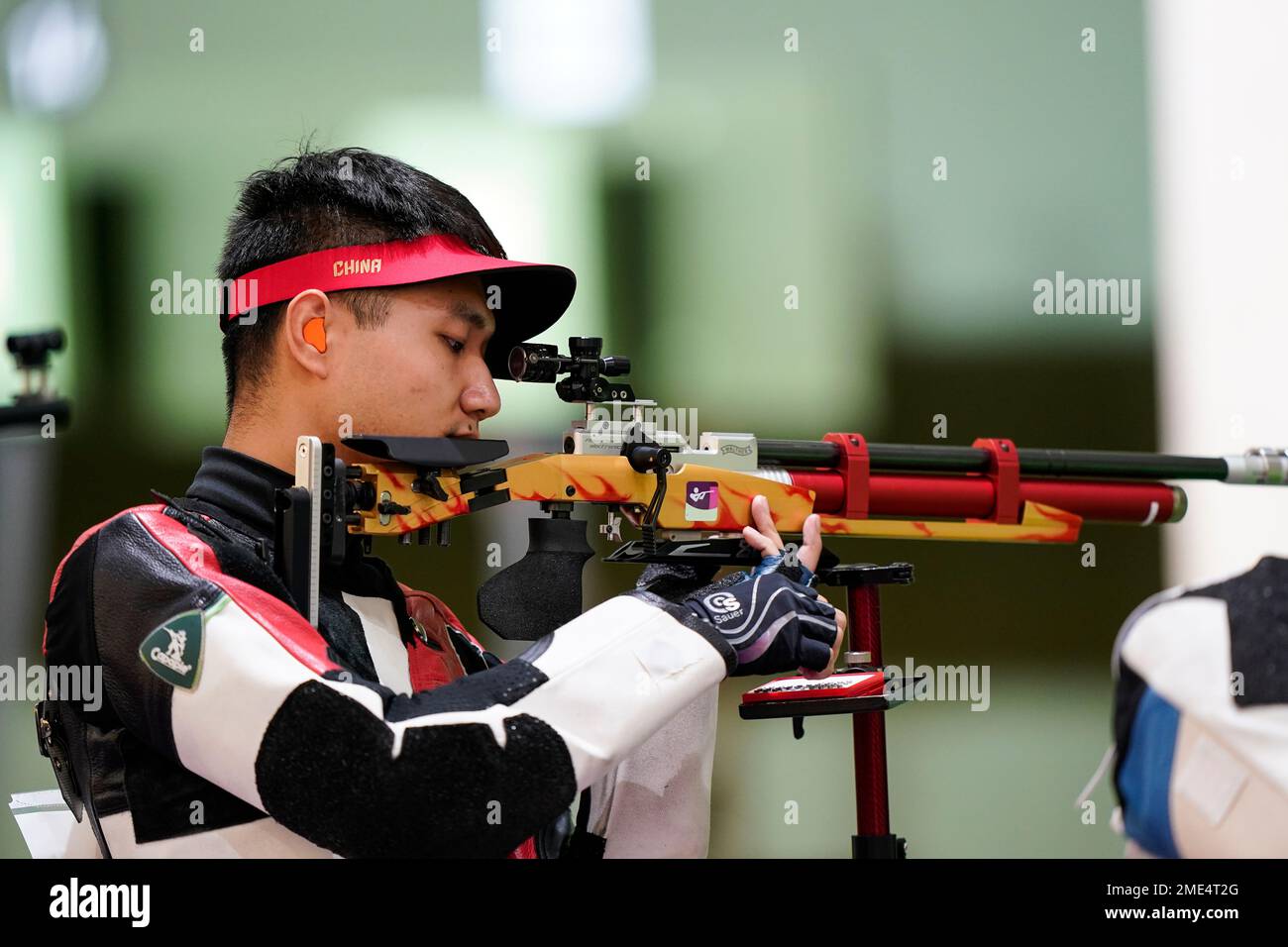 Yang Haoran, of China, competes in the men's 10-meter air rifle at the ...