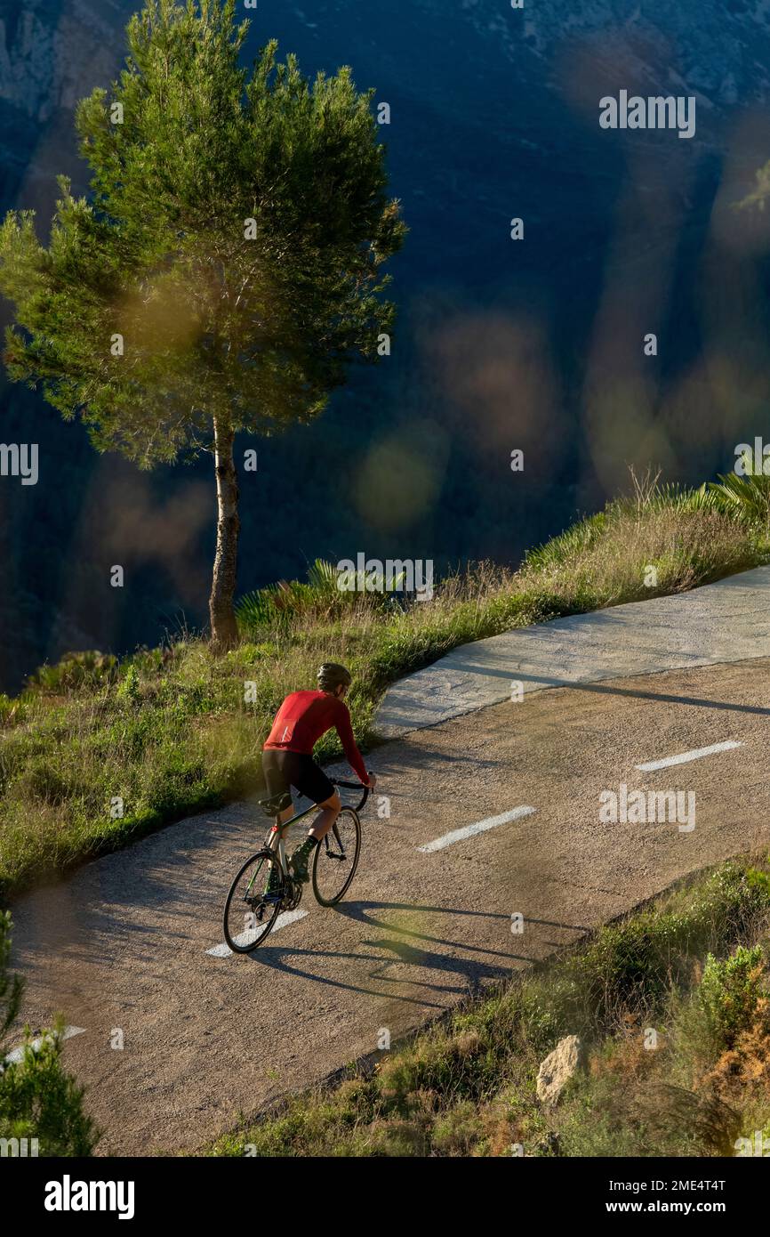 Cyclist riding on narrow hi-res stock photography and images - Alamy