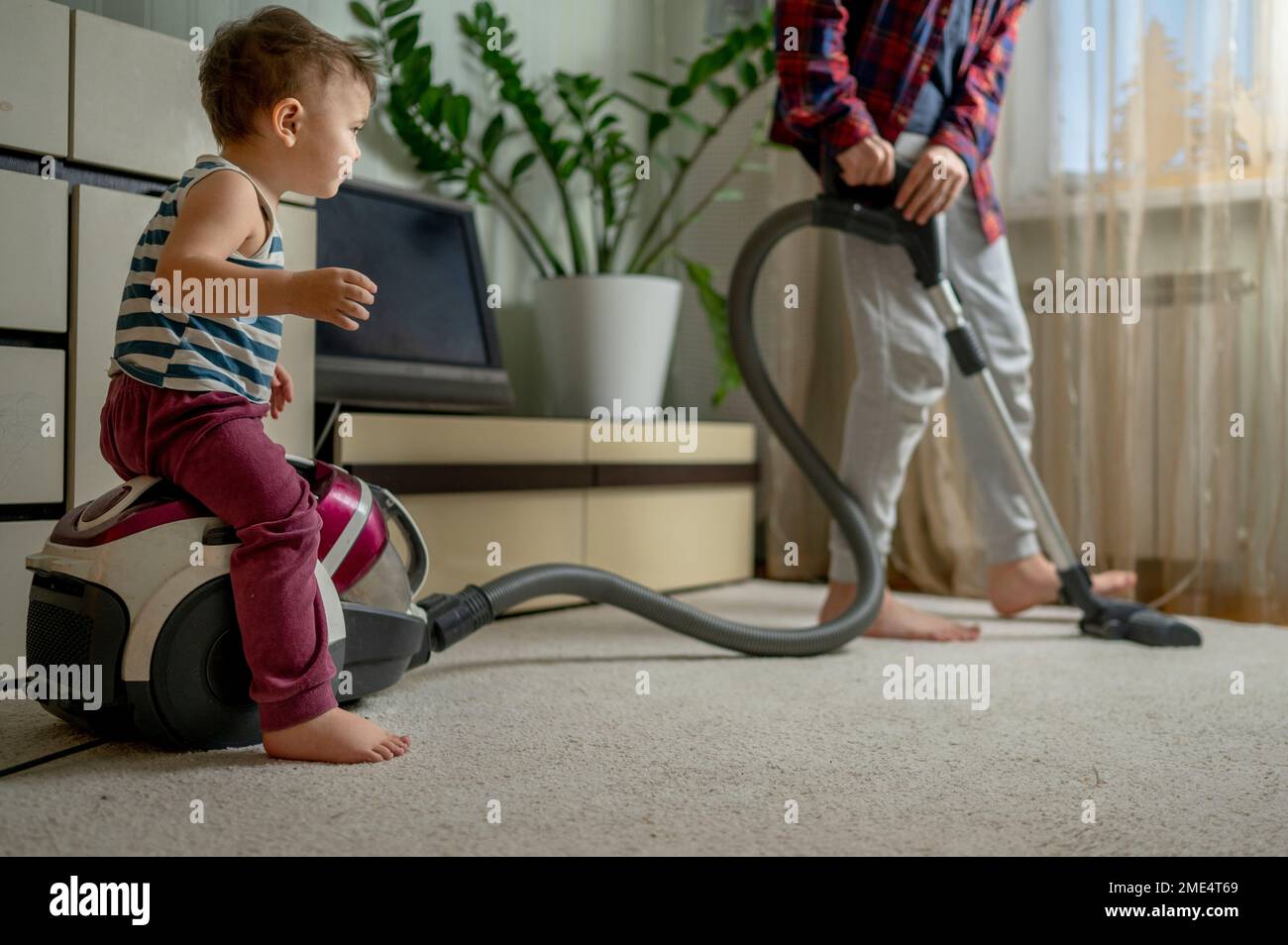 Boy cleaning home hi-res stock photography and images - Alamy
