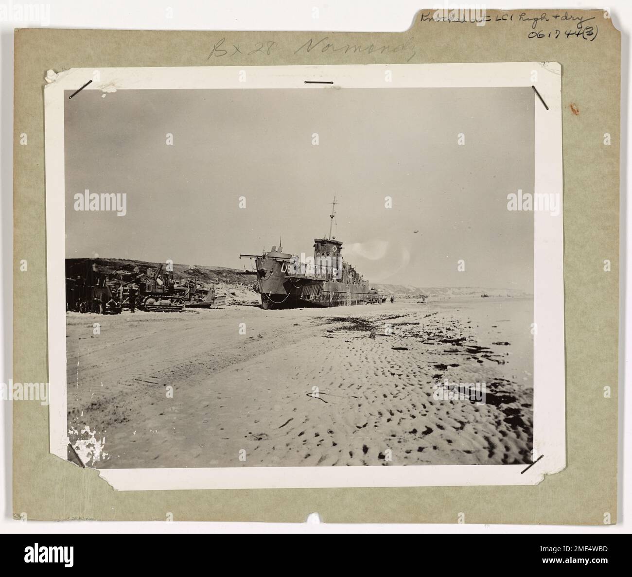 A Coast Guard infantry landing craft (LCI) is shown stranded on a ...