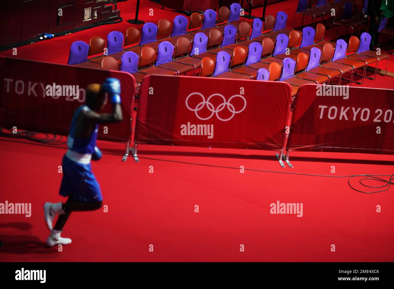 Zambia's Stephen Zimba enters the arena to empty seats for his boxing ...