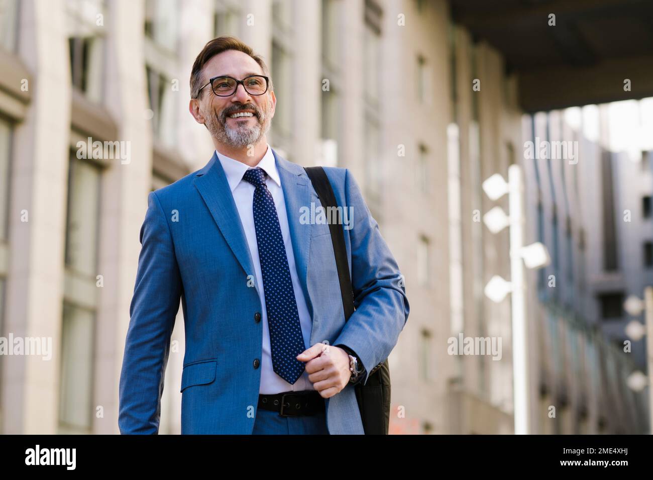 Happy businessman walking outside hi-res stock photography and images ...
