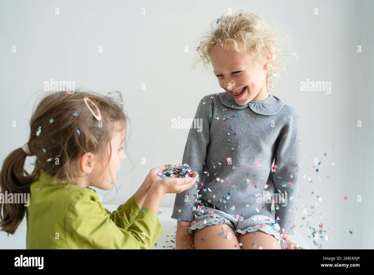 Girl throwing confetti hi-res stock photography and images - Alamy