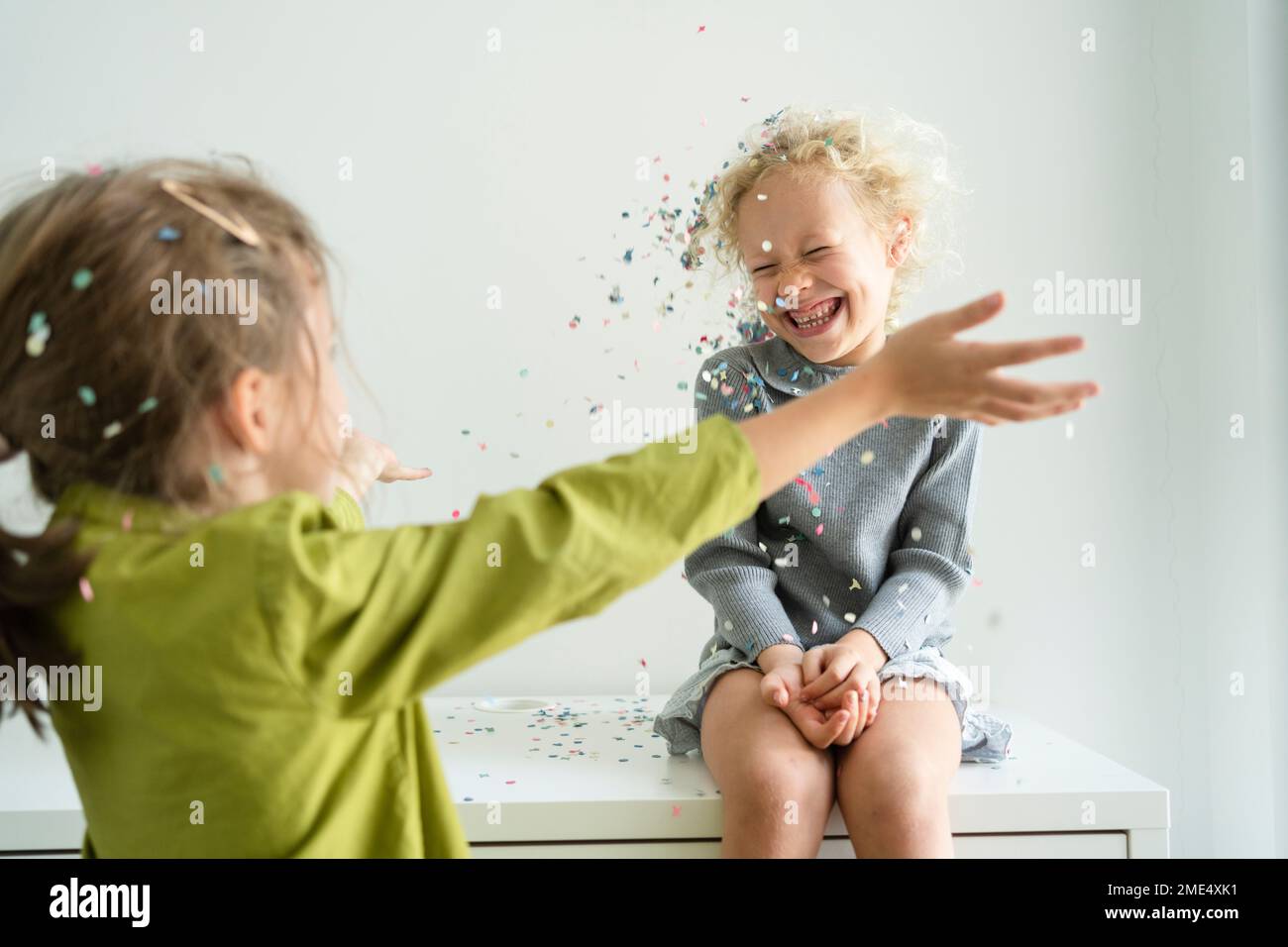 Girl throwing confetti hi-res stock photography and images - Alamy
