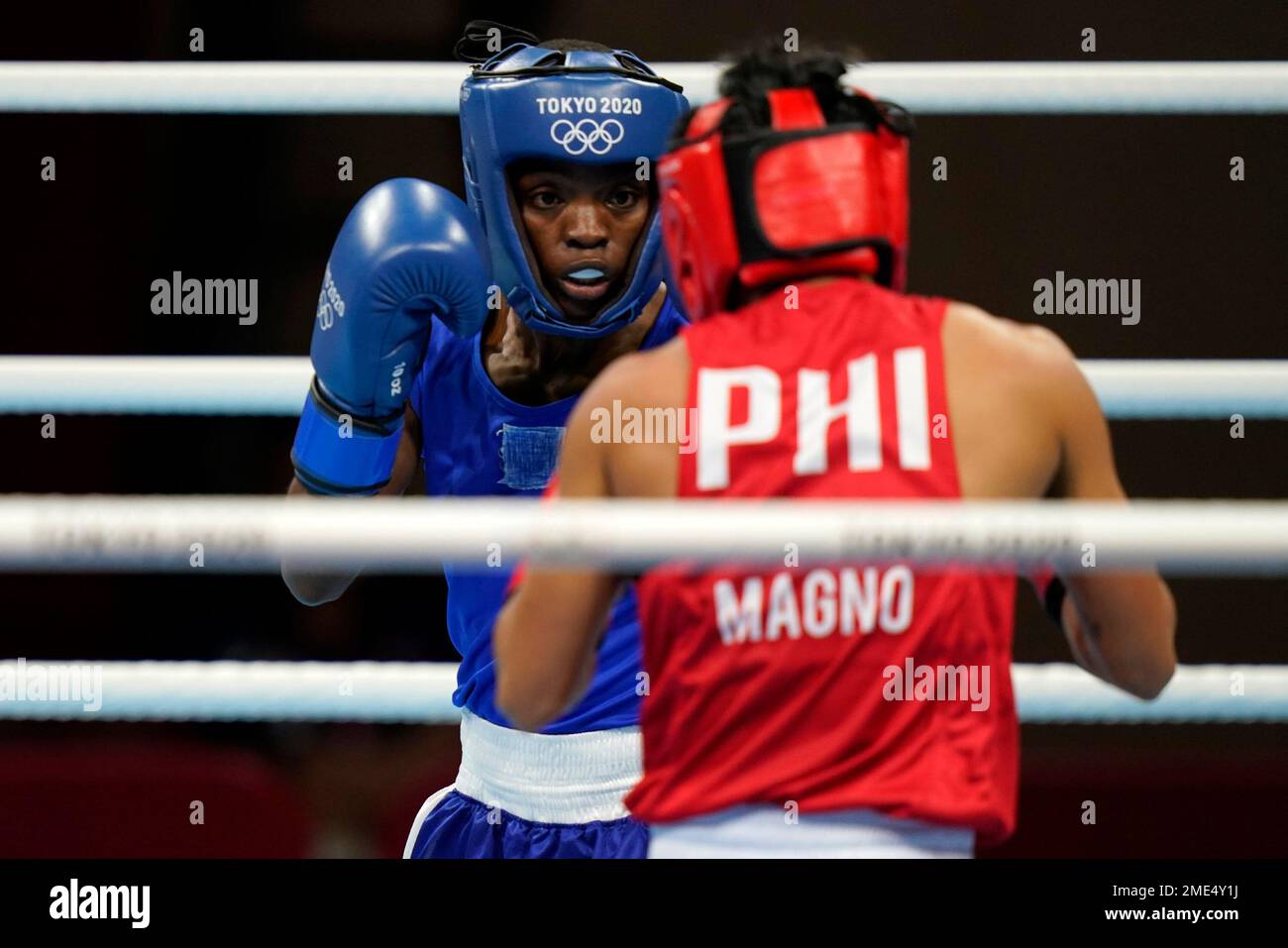 Philippines' Irish Magno, right, exchanges punches with Kenya's ...