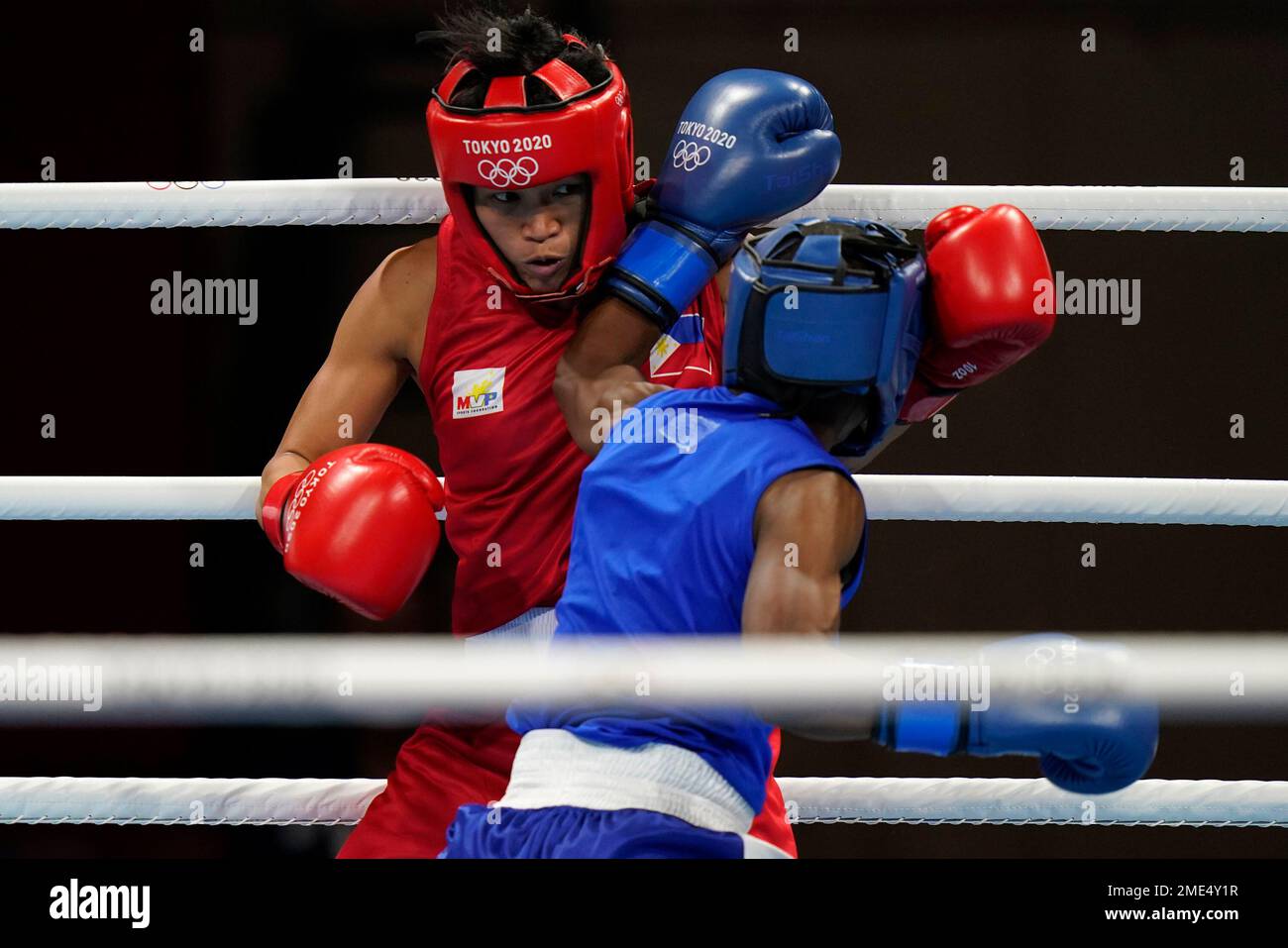 Philippines' Irish Magno, left, exchanges punches with Kenya's ...
