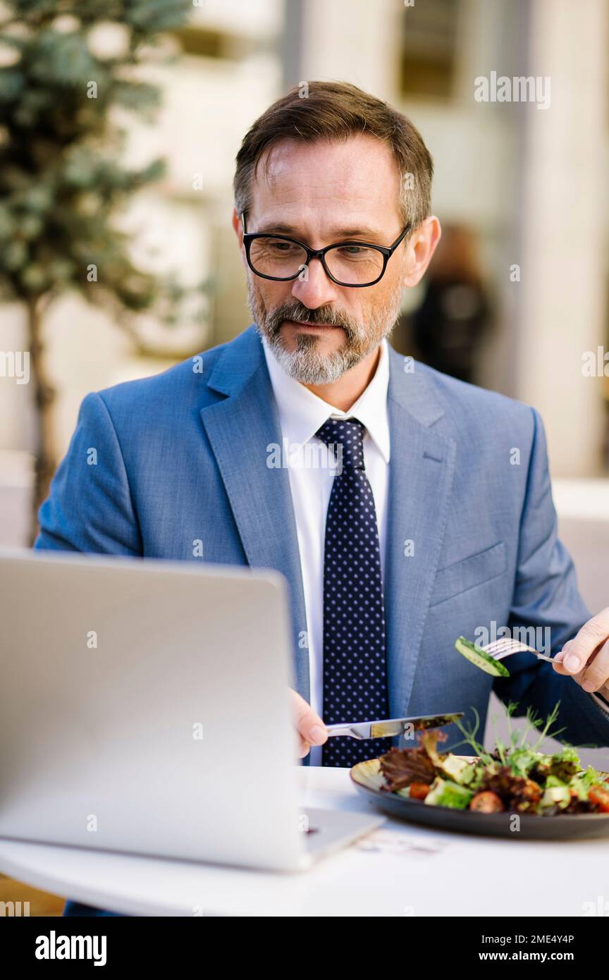 Businessman eating lunch in cafe hi-res stock photography and images ...