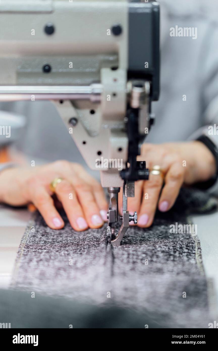 Women using sewing machine close hi-res stock photography and images ...