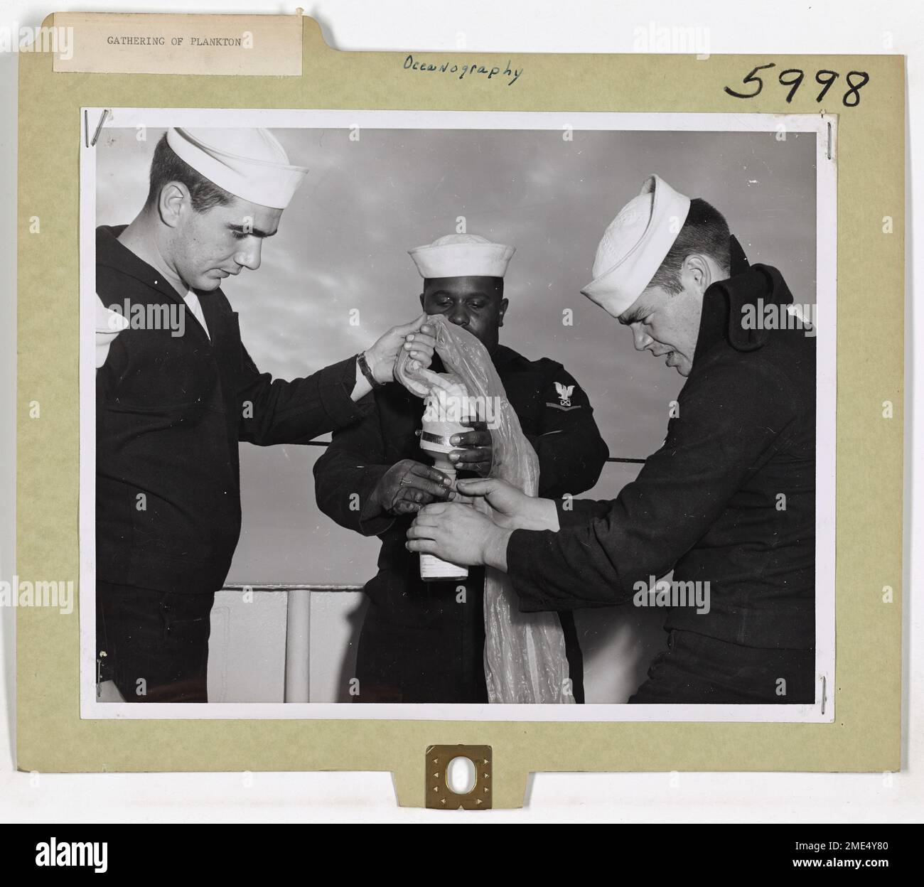 Crewmembers aboard the U.S. Coast Guard Cutter Dibb gather plankton ...