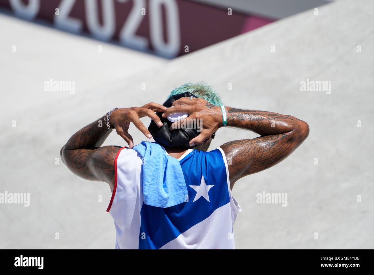 Manny Santiago of Puerto Rico cools off after competing in the men's ...
