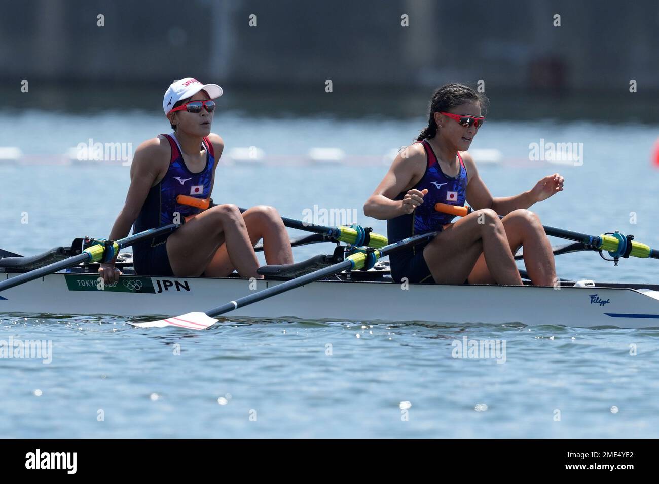 Ayami Oishi and Chiaki Tomita, of Japan, react after competing in the ...