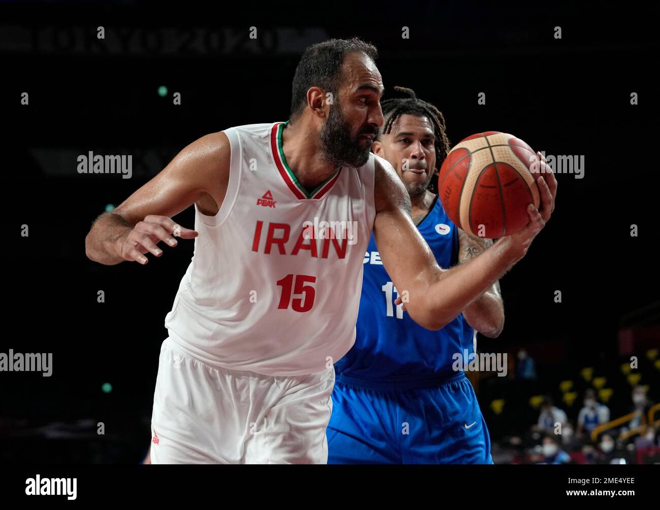Iran's Hamed Haddadi (15) carries the ball past Czech Republic's Blake ...