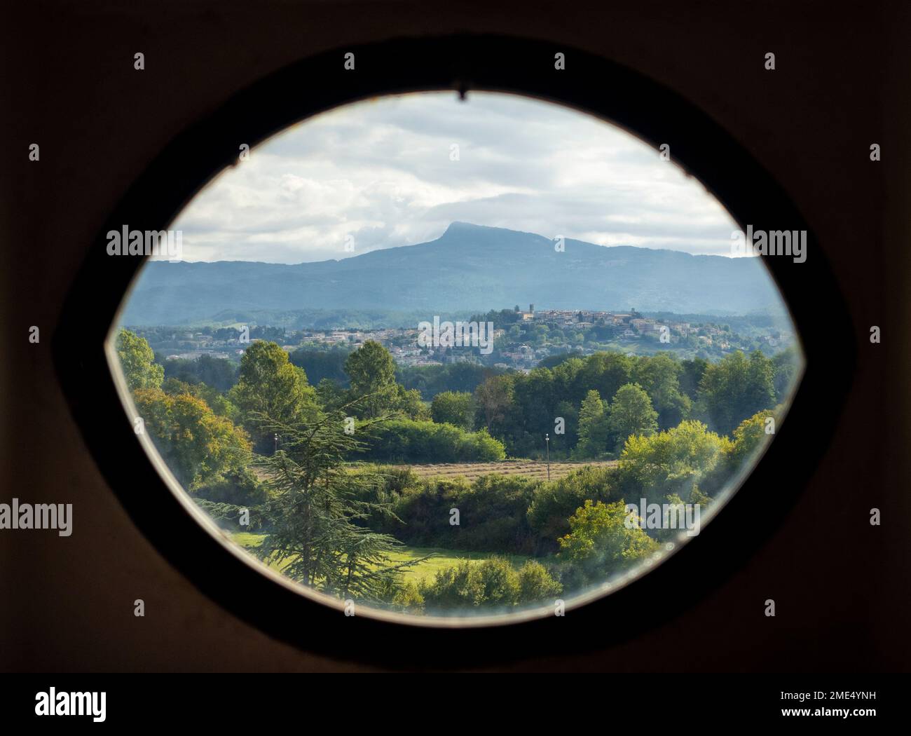 Town in Bibbiena seen through transparent glass window Stock Photo - Alamy