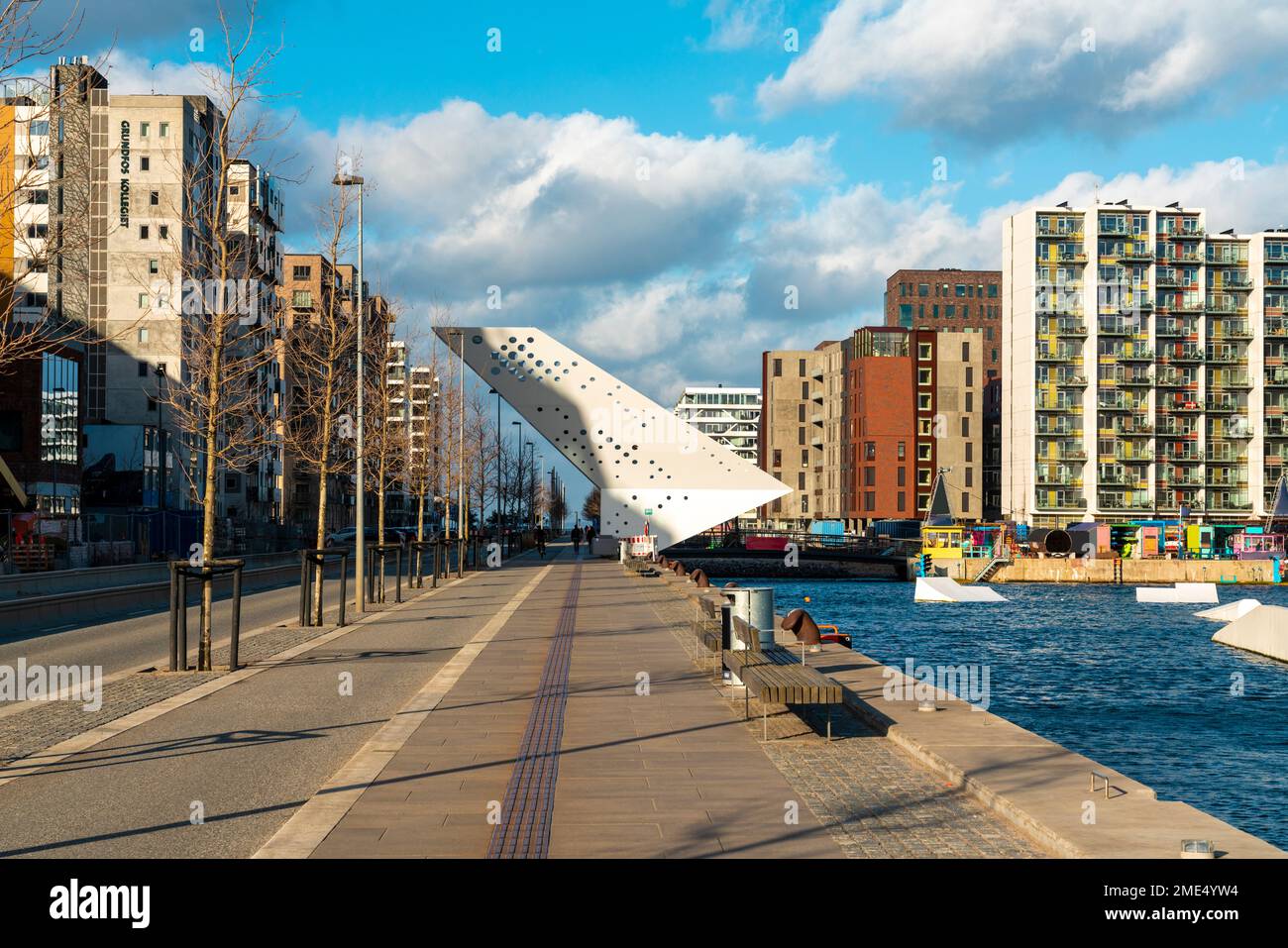 Denmark, Aarhus, Empty promenade with modern sculpture and apartment ...