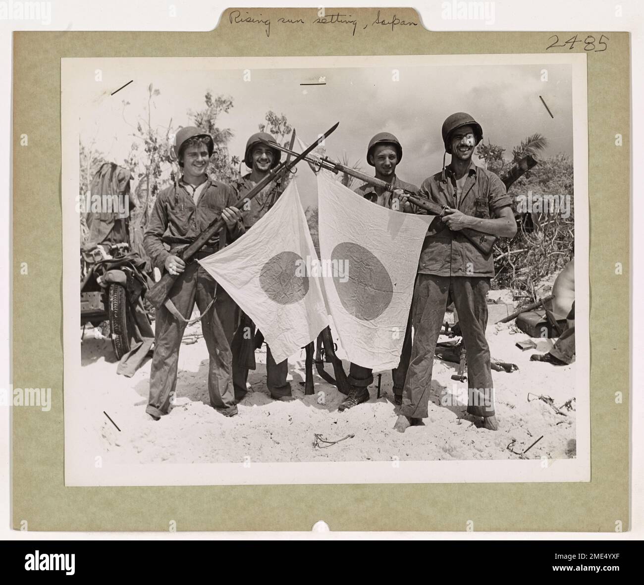 Coast Guard and Navy personnel display Japanese flags captured during ...