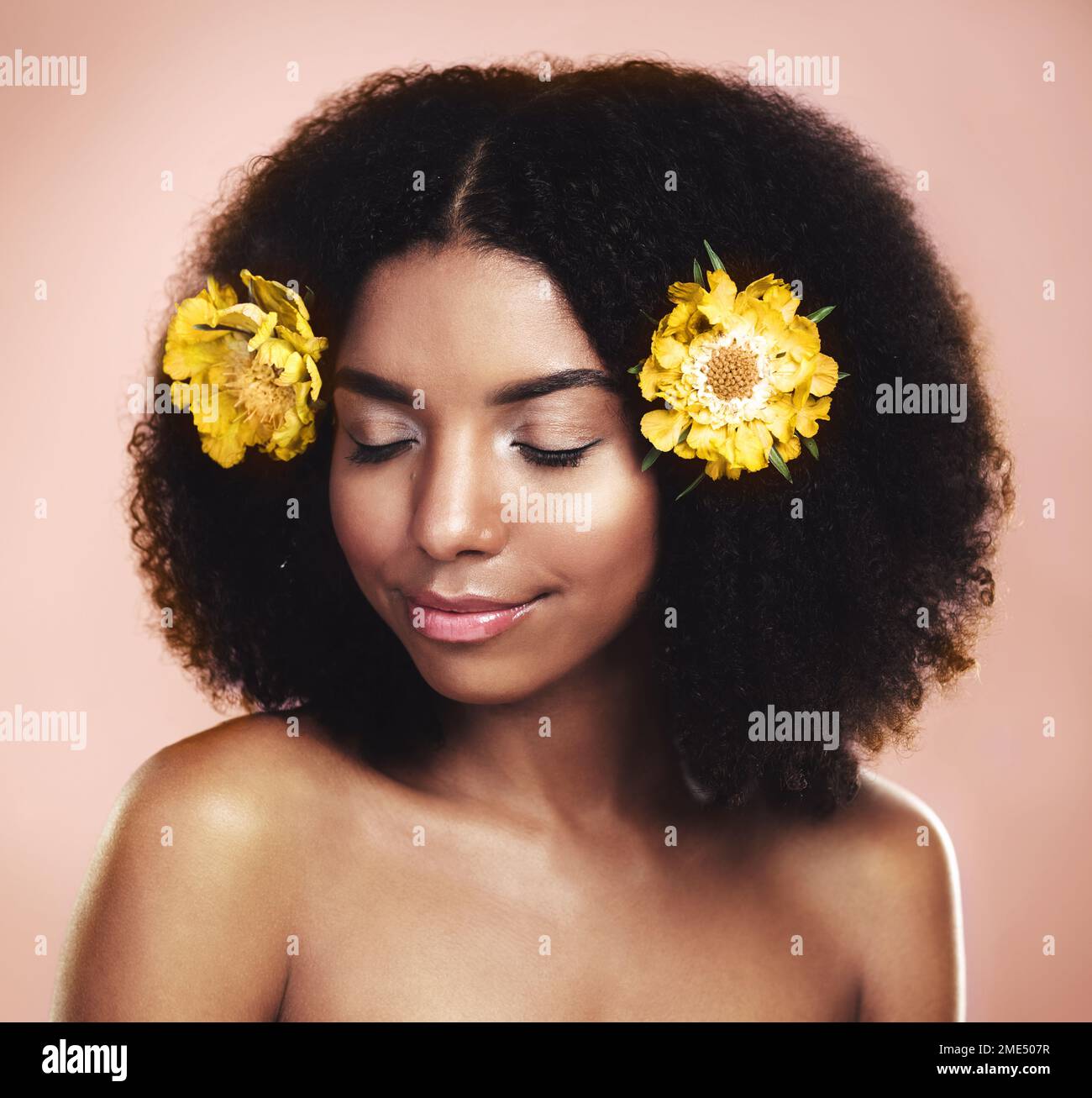 Live life in full bloom. Studio shot of a beautiful young woman posing ...