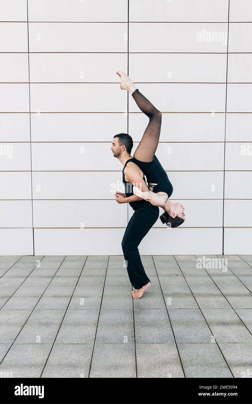 Lifting picking woman up hi-res stock photography and images - Alamy