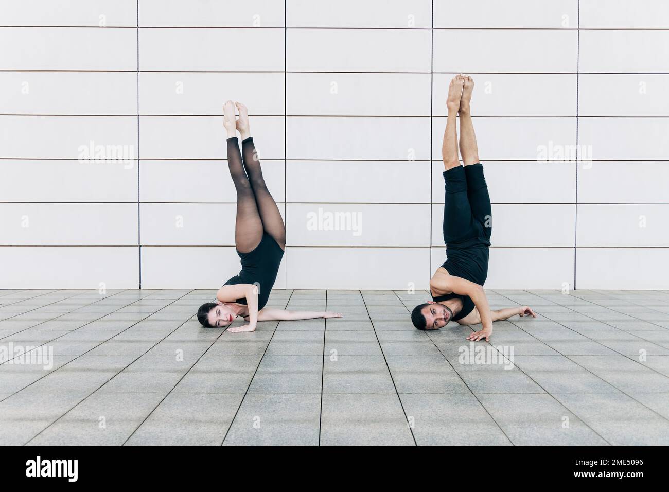 Man two women doing headstand hi-res stock photography and images - Alamy