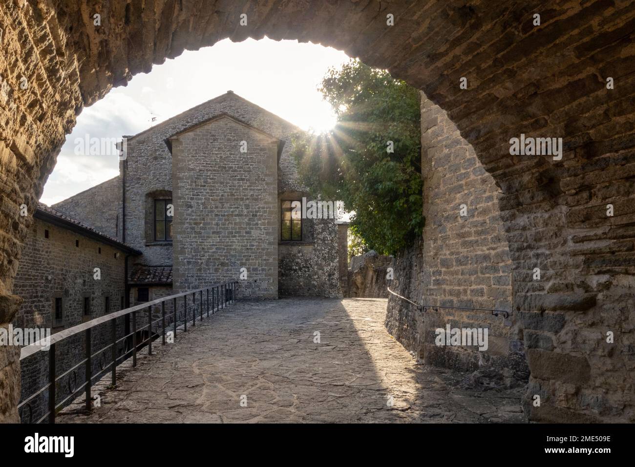 Sanctuary of La Verna on sunny day seen through arch of tunnel Stock ...