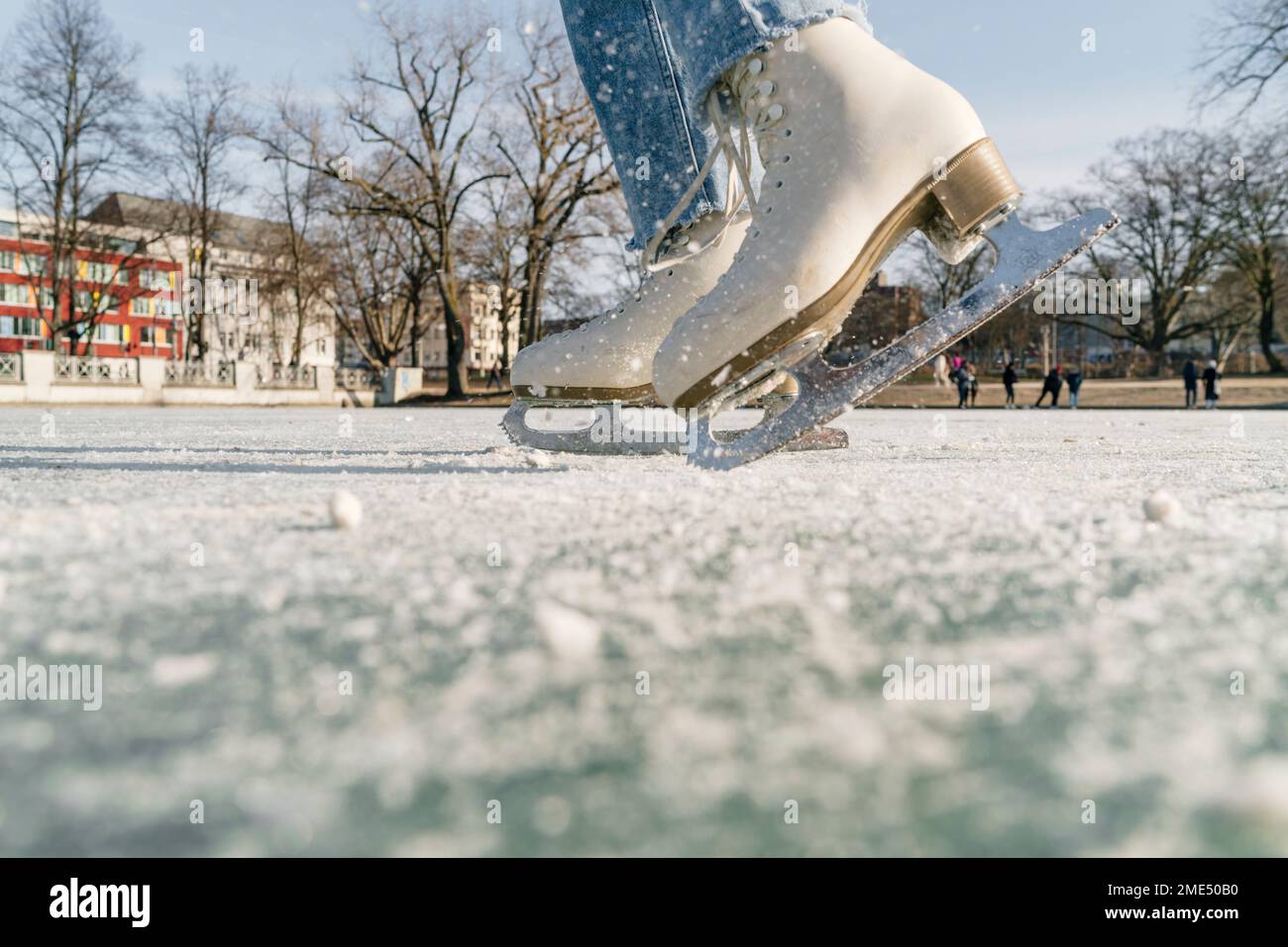 Girl skating on ice rink in winter Stock Photo - Alamy