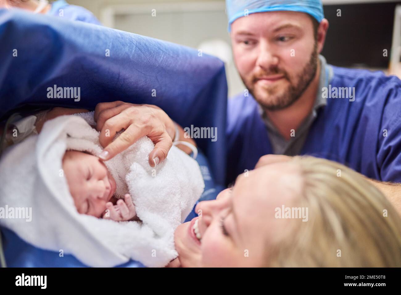 Welcome to the world sweet angel. a beautiful young couple welcoming their newly born baby girl ...