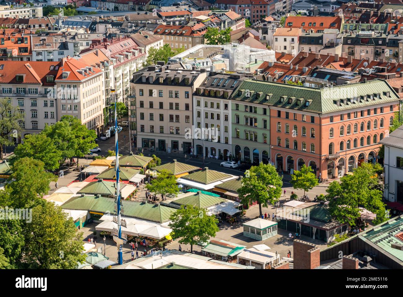 Germany, Munich, Victuals Market with apartment buildings in background ...