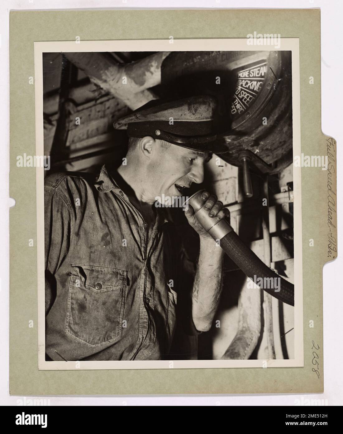 A member of the engine room crew aboard a U.S. Coast Guard cutter ...