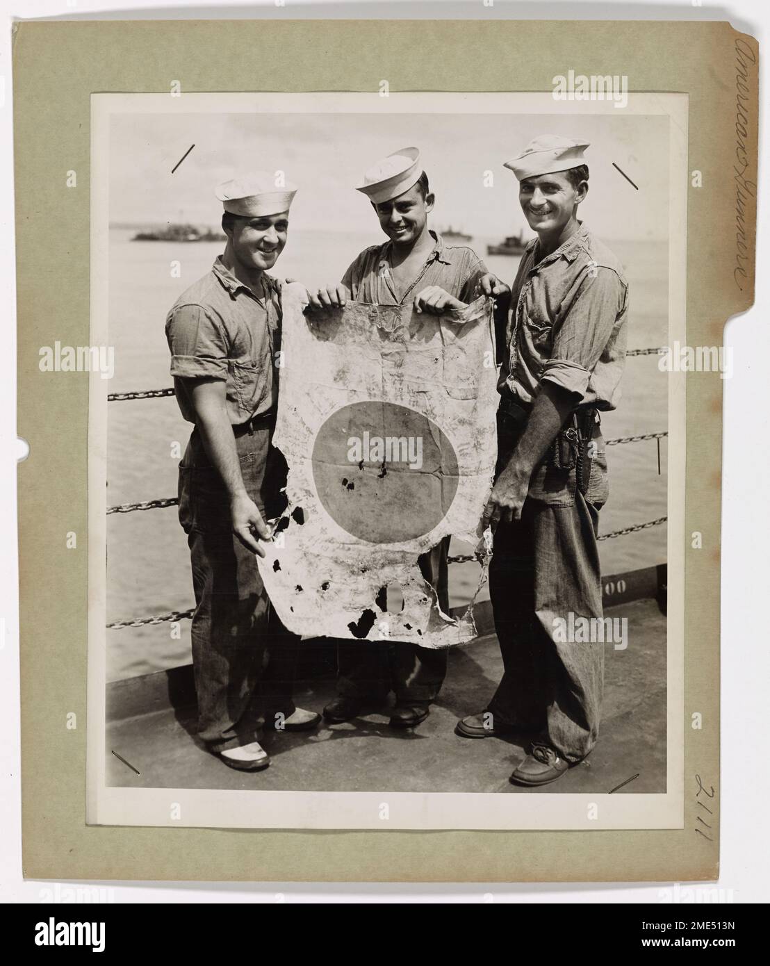 Coast Guardsmen aboard an assault transport in the Southwest Pacific ...