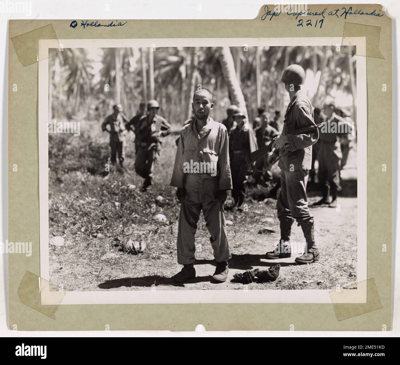 A Coast Guard combat photographer captures a Japanese prisoner at ...