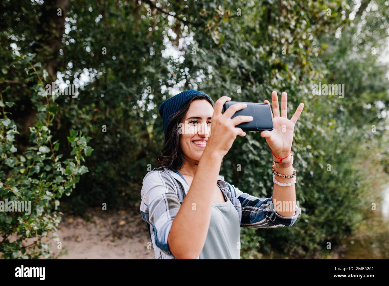 Woman using clicking phone green hi-res stock photography and images ...